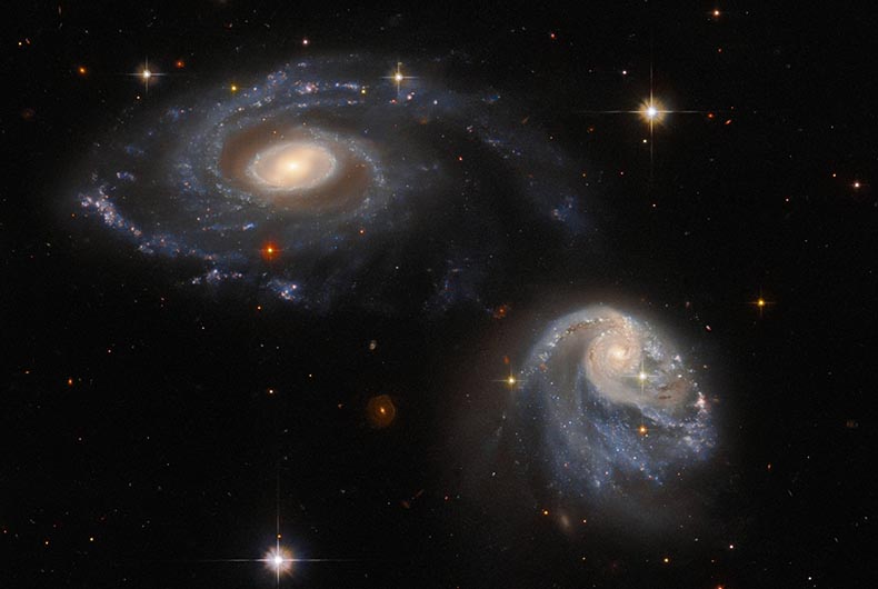 Hubble captures two interacting Galaxies; Spectacular pair, says NASA ...